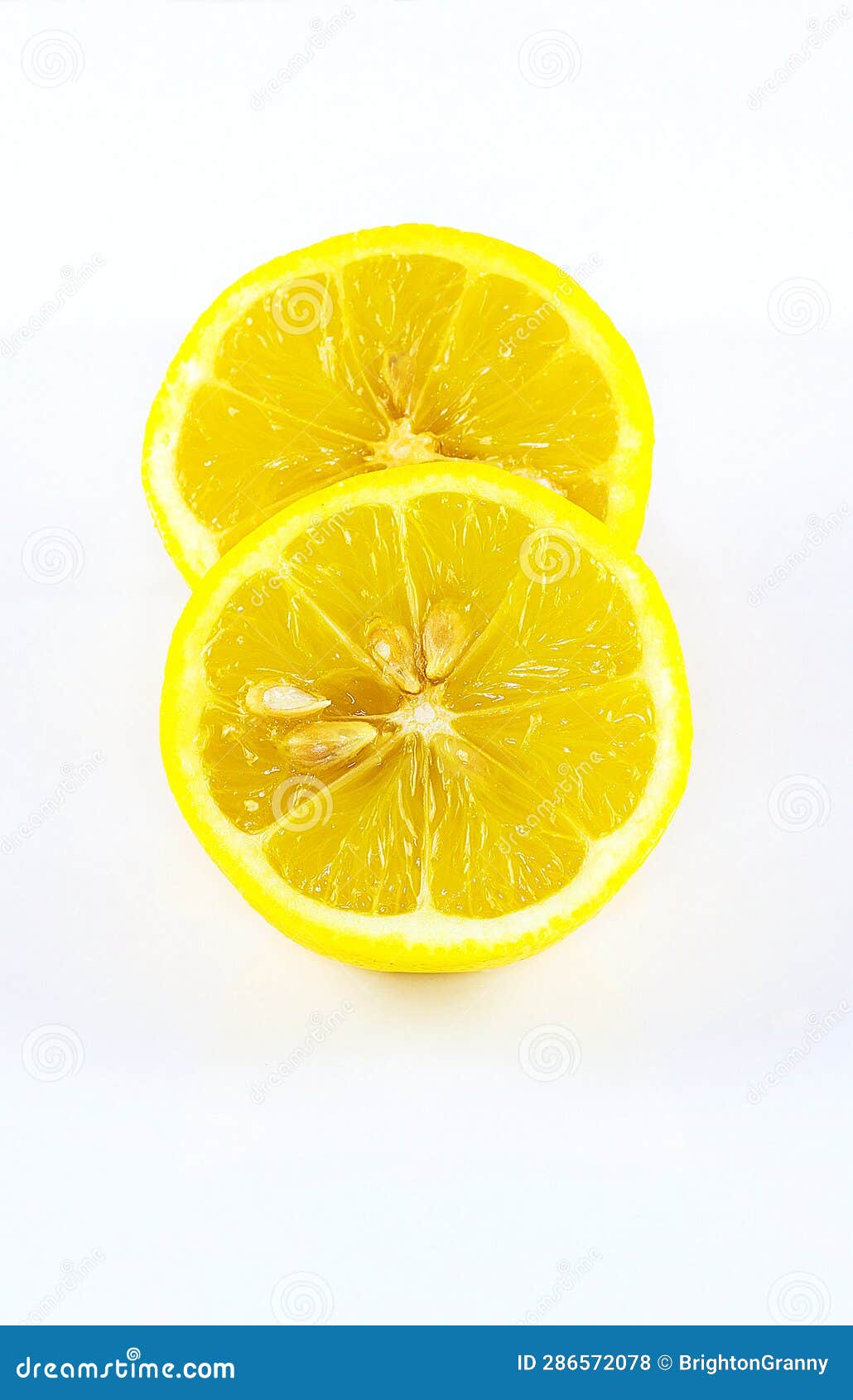 A Single Bright Yellow Lemon Cut in Half. Stock Photo - Image of ...