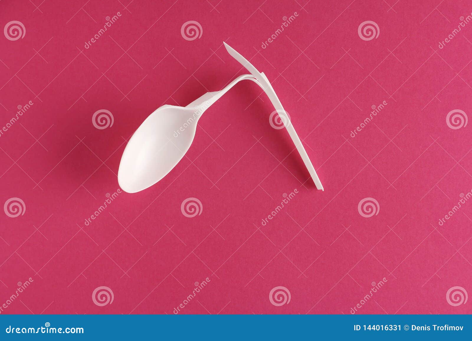 Single Broken White Disposable Plastic Spoon on Pink Background, Non ...