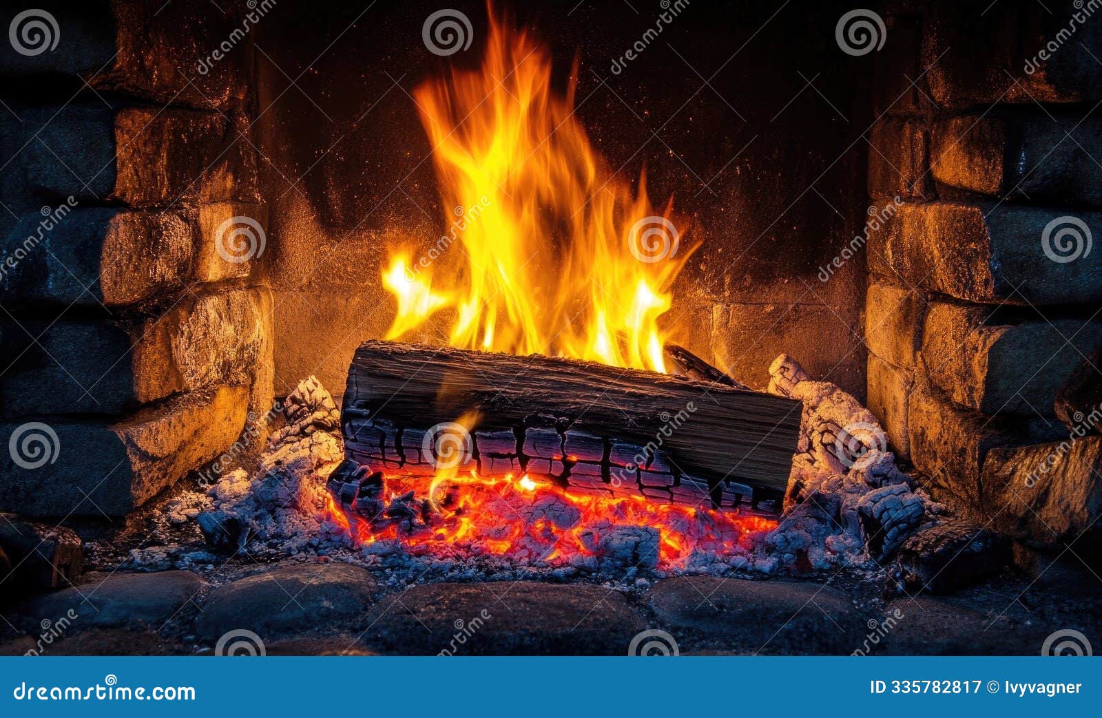 A Single Burning Log Resting in a Stone Fireplace Stock Image - Image ...