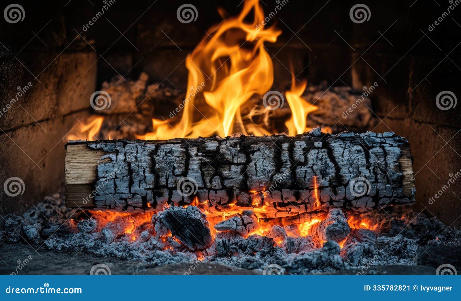 A Single Burning Log Resting in a Stone Fireplace Stock Image - Image ...