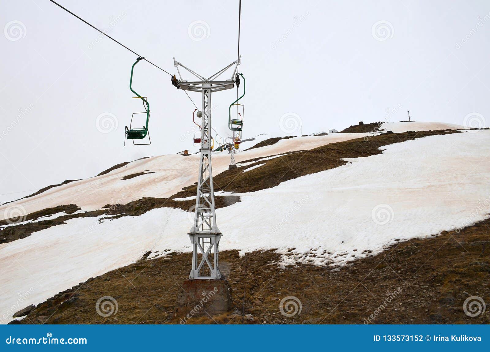 Single Cable Car with Colorful Seats on a Snowy Mountain. Bottom Stock ...
