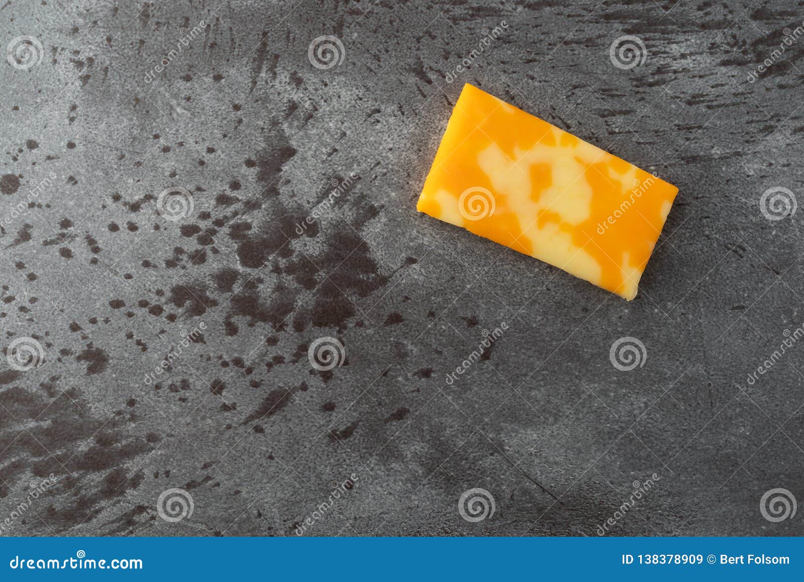 Single Colby Jack Cheese Bar Offset on a Gray Background Top View Stock ...