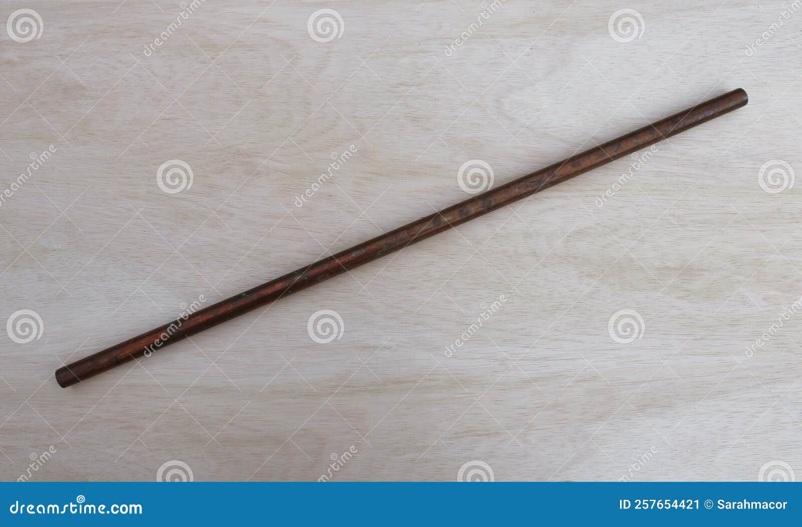 A Single Copper Pipe on a Wood Background Stock Image - Image of dirty ...