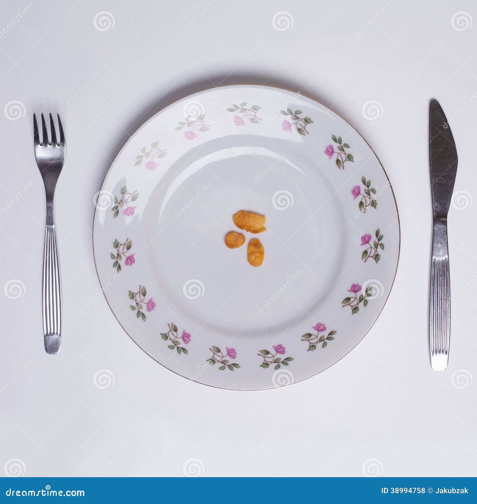 Single Cornflake on a Plate. Symbol of Famines and Poverty.Isolated on ...