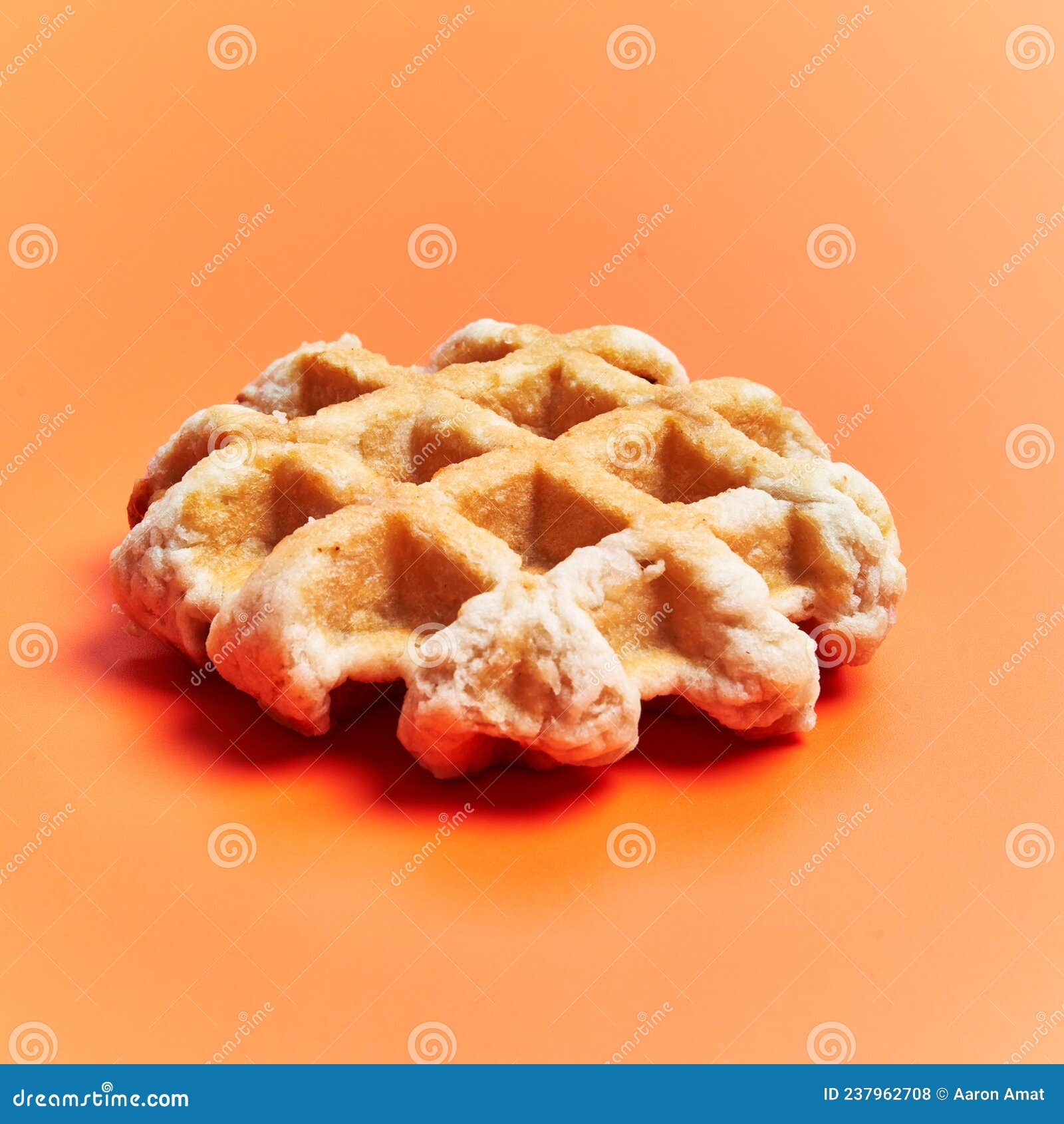 Single Delicious Waffle Over Orange Background Stock Photo - Image of ...