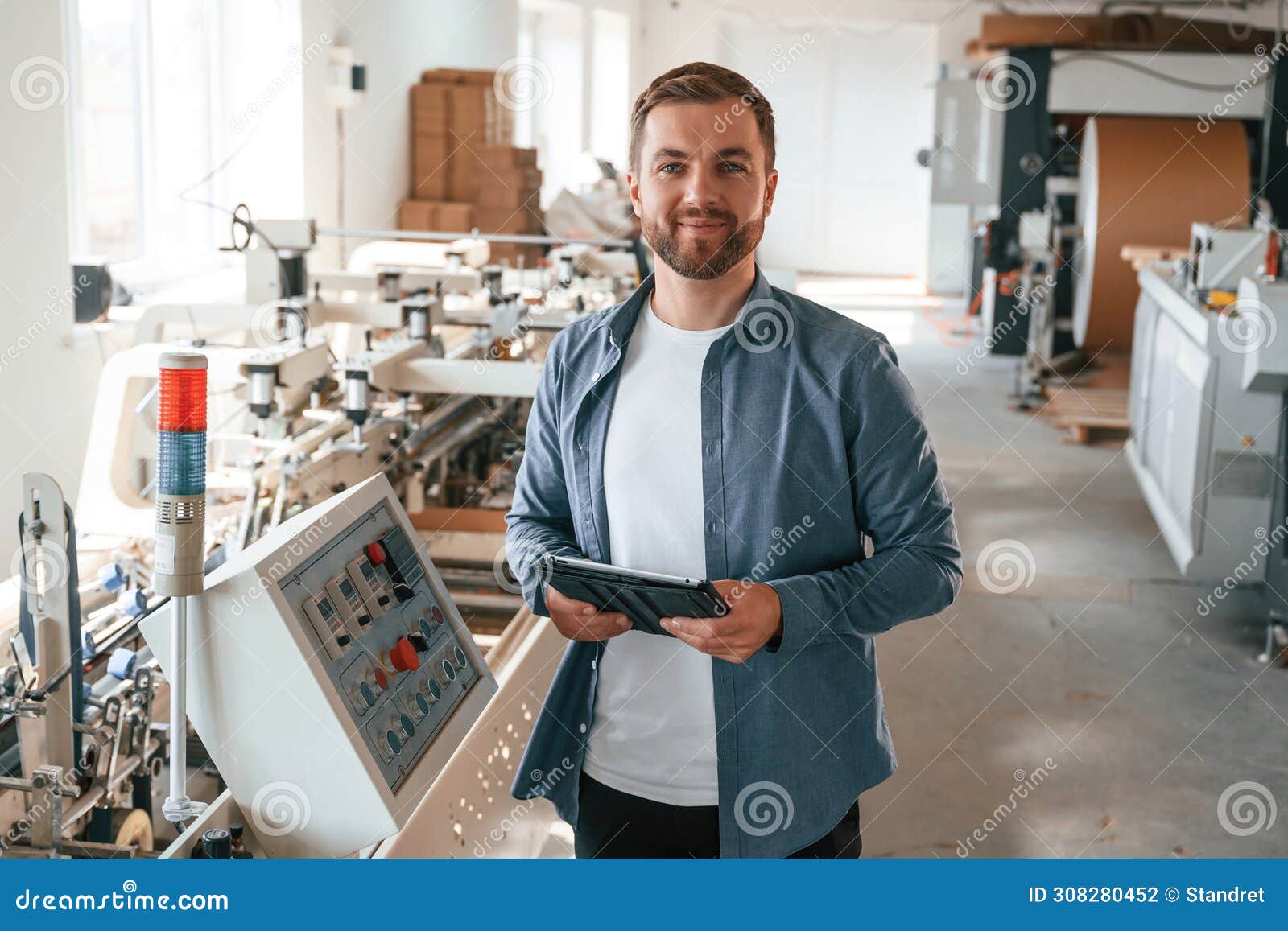 Single Employee. Handsome Man is Working at the Factory of Creating Eco ...