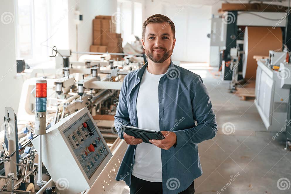 Single Employee. Handsome Man is Working at the Factory of Creating Eco ...