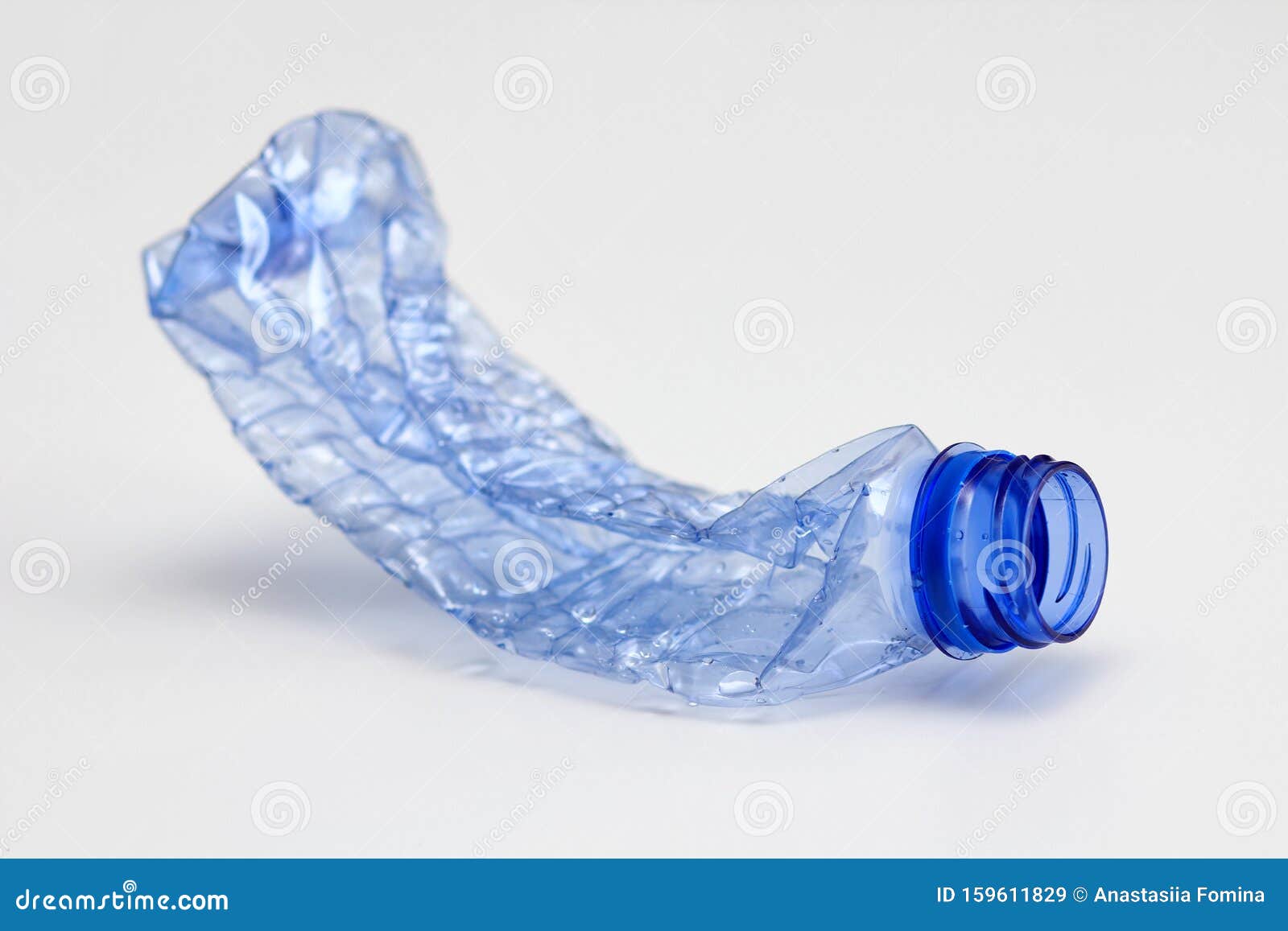 Single Empty Blue Plastic Bottle on White Background. Waste Recycling ...