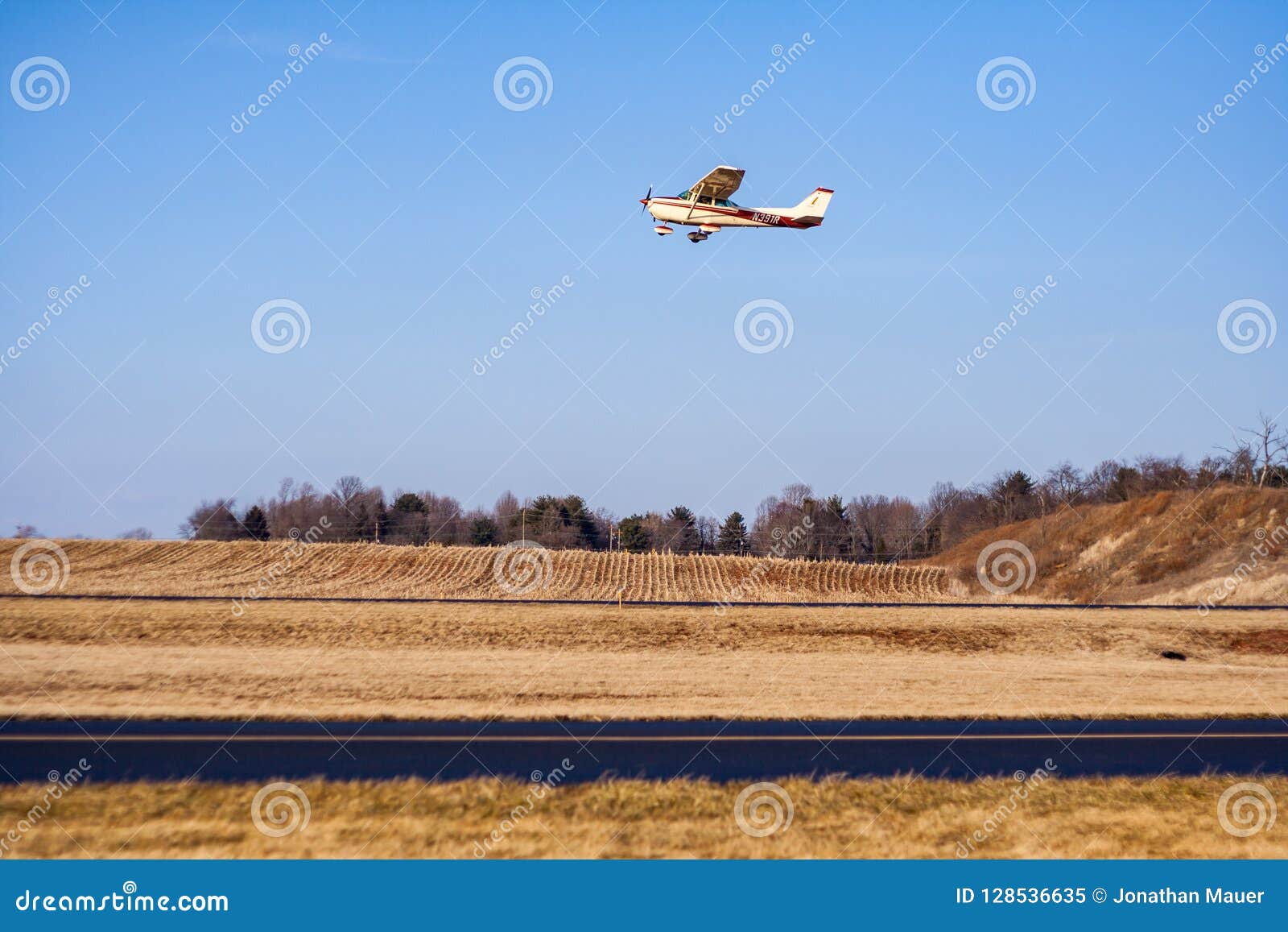Single Engine Propeller Plane Flying Over Runway in Autumn Editorial ...