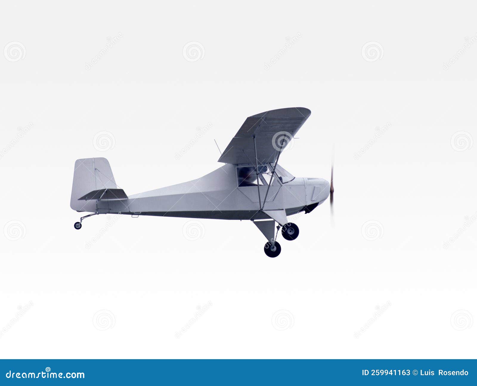 Single Engine Ultralight Plane Flying in the Blue Sk Stock Image ...