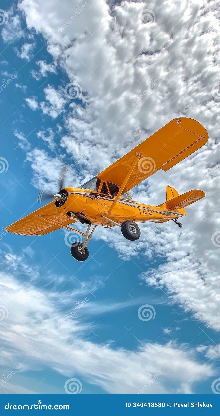 Single Engine Ultralight Prop Plane Flying in the Blue Sky with White ...