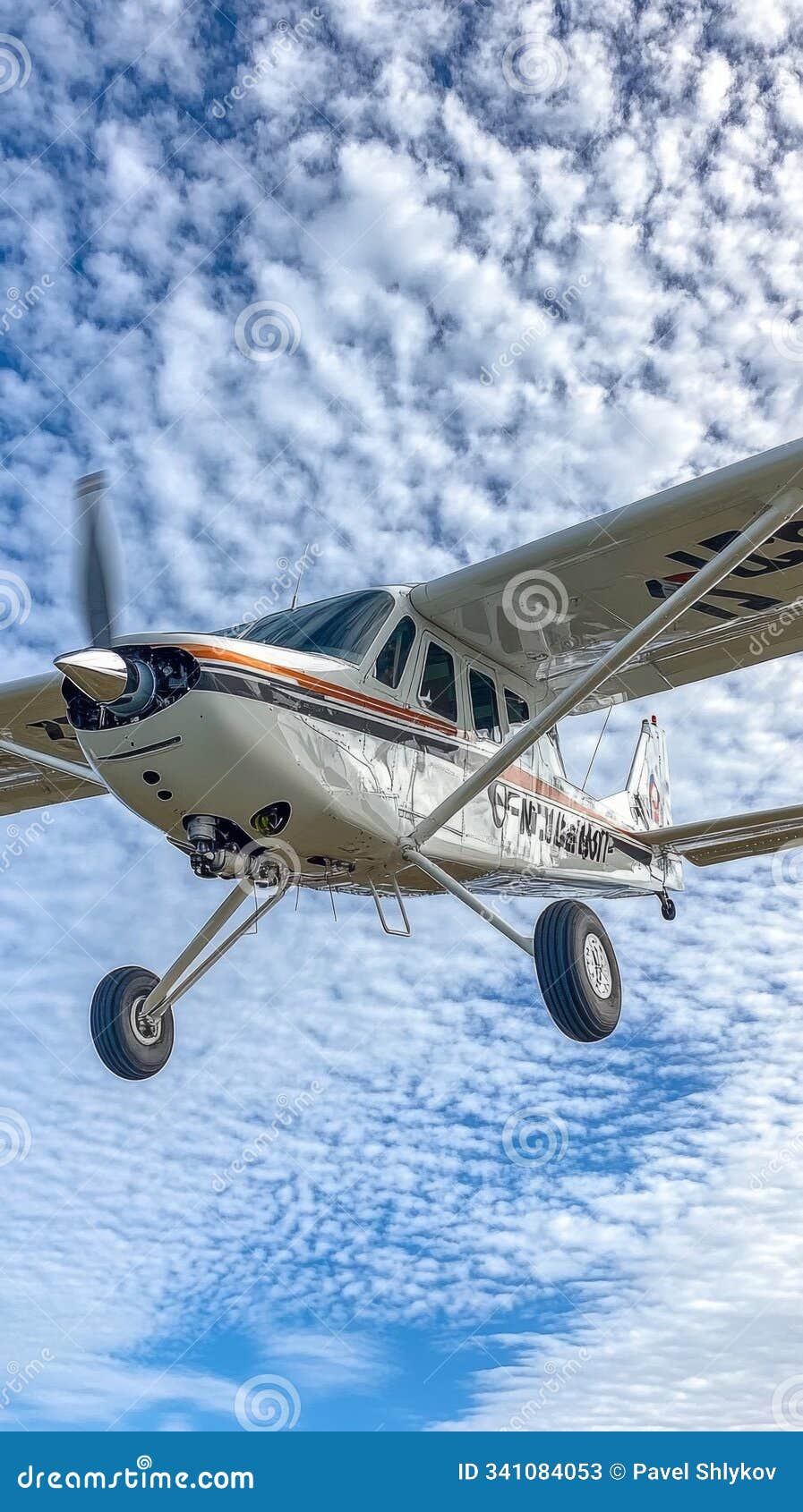 Single Engine Ultralight Prop Plane Flying in the Blue Sky with White ...