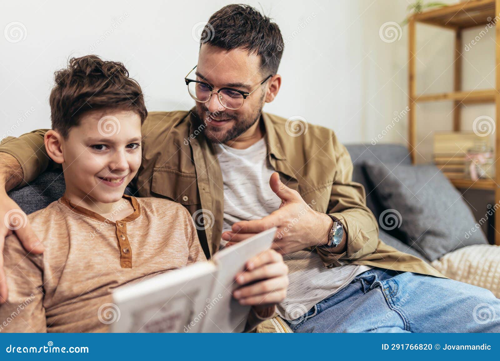 Single Father Reading a Book with His Son Stock Photo - Image of ...