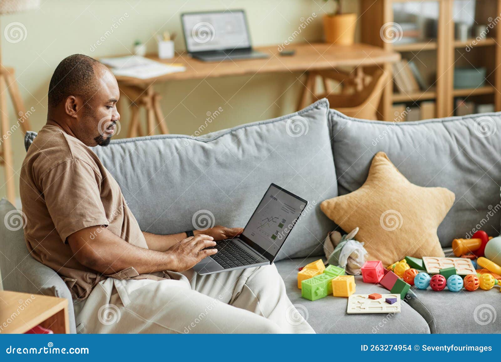 Single Father Working from Home and Using Laptop Stock Photo - Image of ...