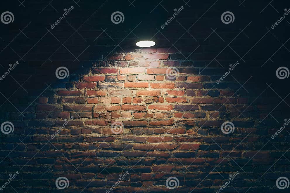 Single Flood Light Partially Illuminates Rustic Brick Wall Stock ...