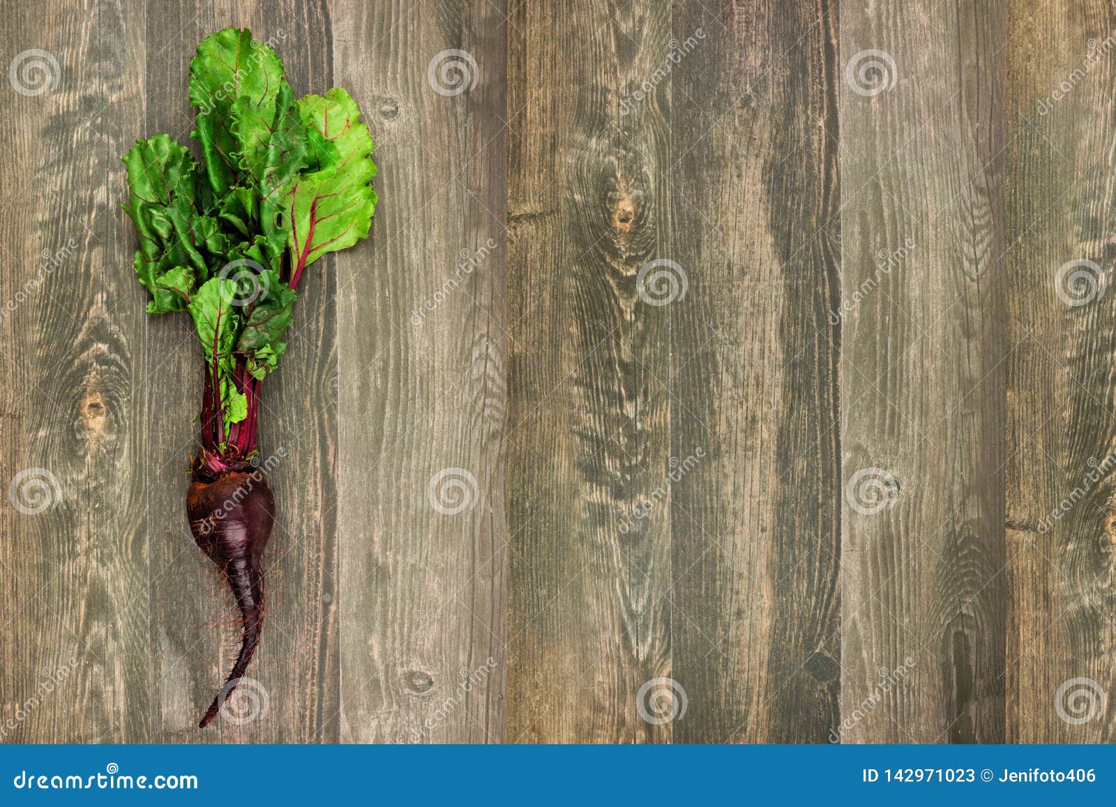 Single Beetroot with Leaves Over Rustic Wood Stock Image - Image of ...