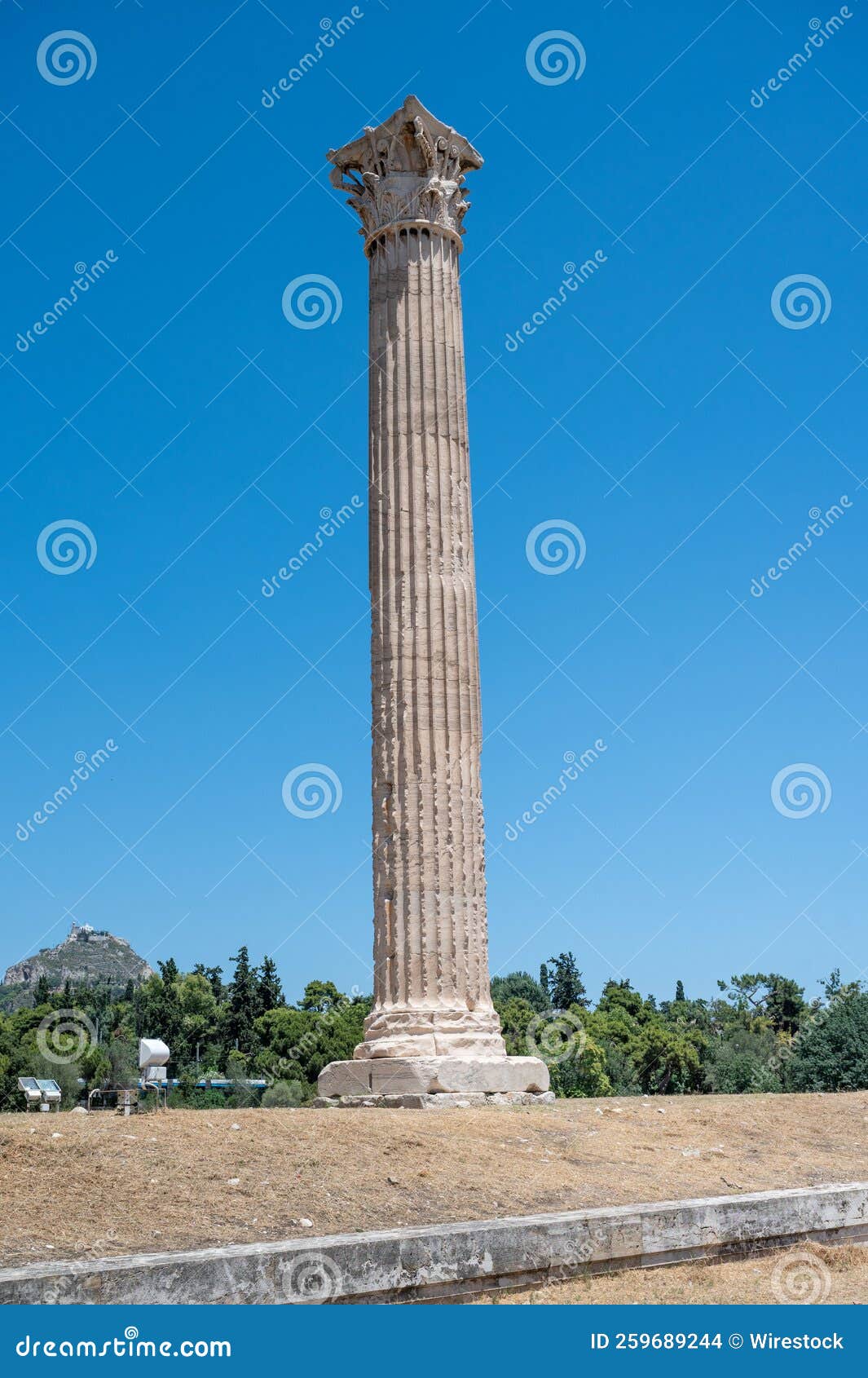 Single Greek Ancient Column on the Ground, Vertical Stock Photo - Image ...