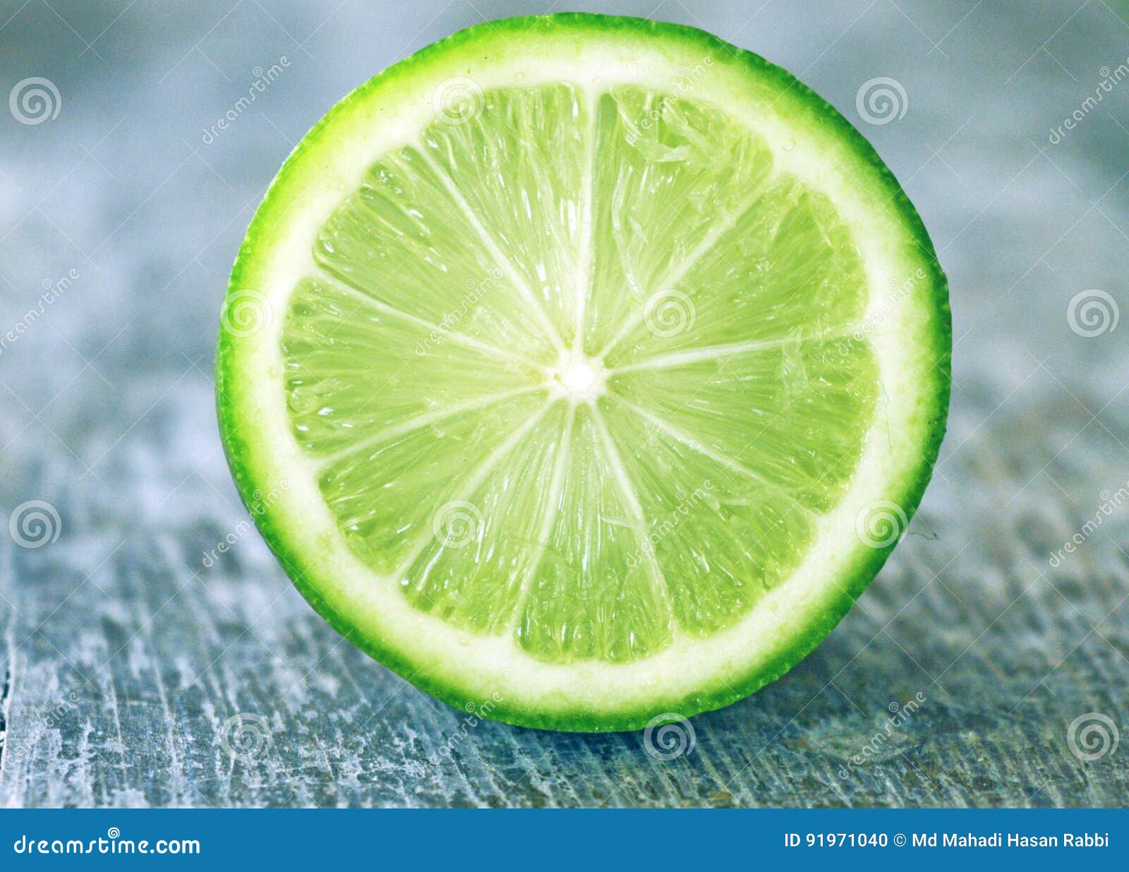 Single Green Lemon Slice stock photo. Image of juicy - 91971040