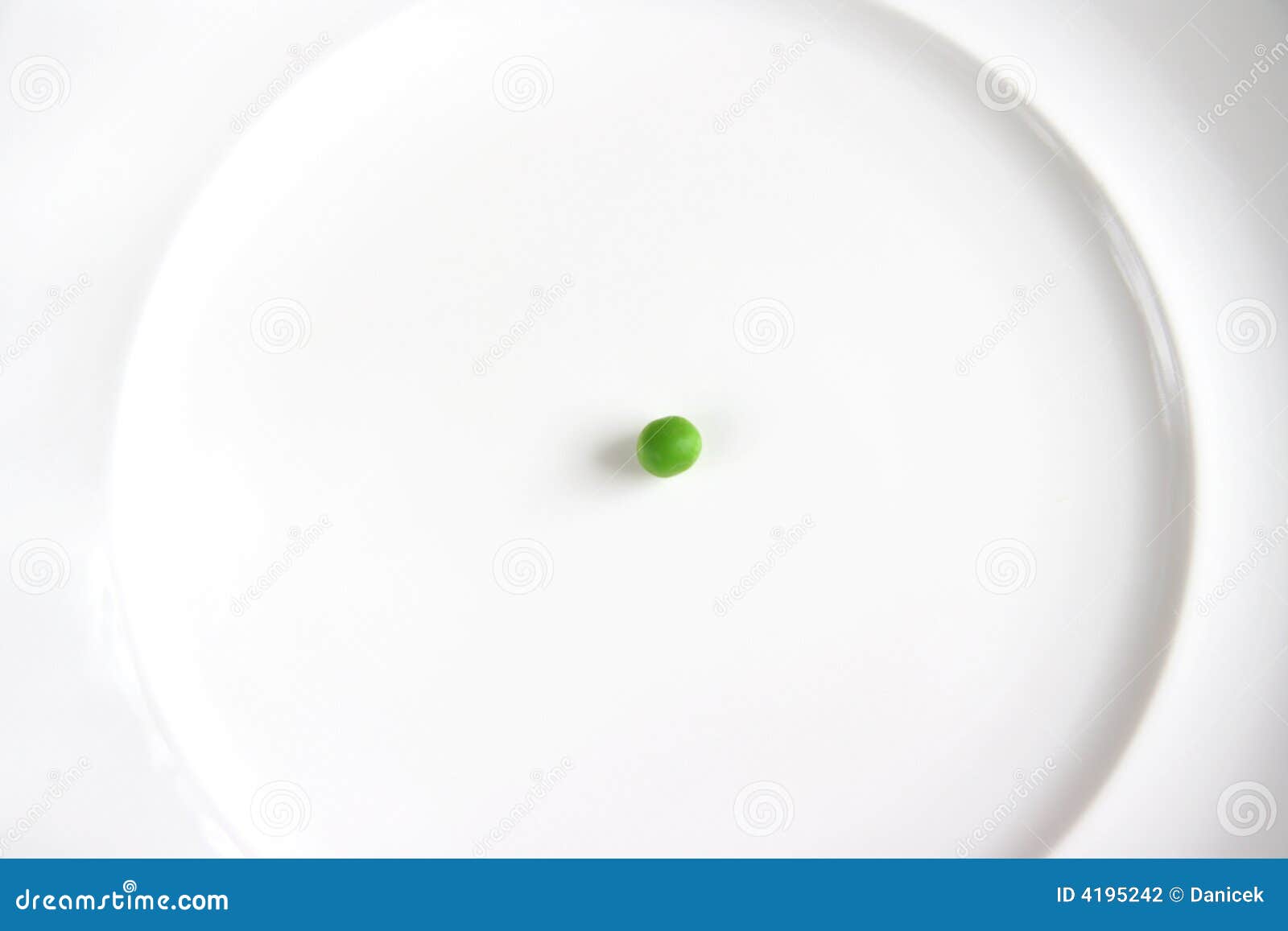 Single Green Pea On White Plate. Stock Photo - Image: 4195242