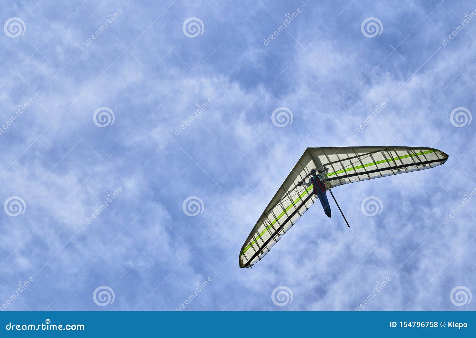 A Single Hang Glider Aginst a Cloudy Sky. Stock Photo - Image of ...