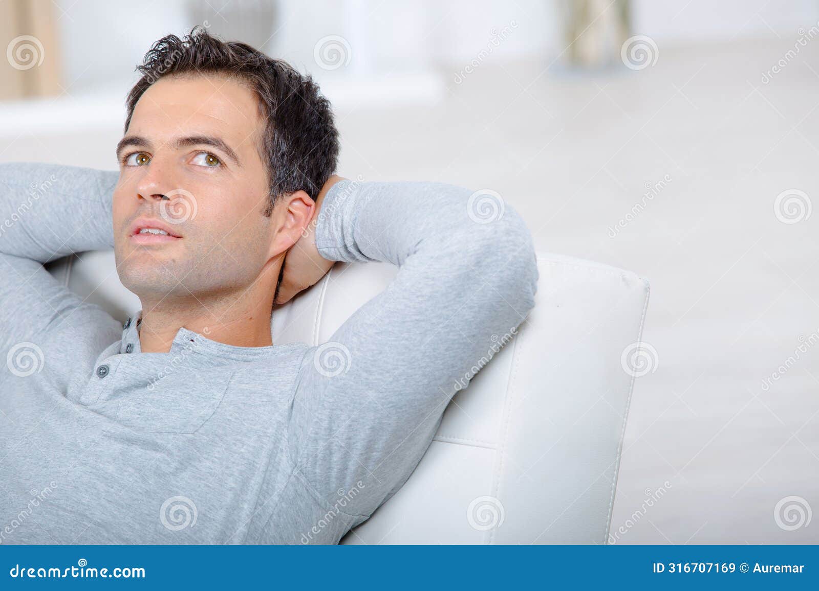 Single Happy Young Man Relaxing on Sofa at Home Stock Image - Image of ...