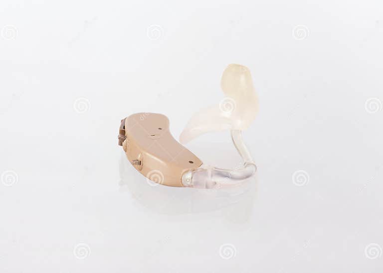 Single Hearing Aid on a Glass Surface with Its Reflection Stock Image ...