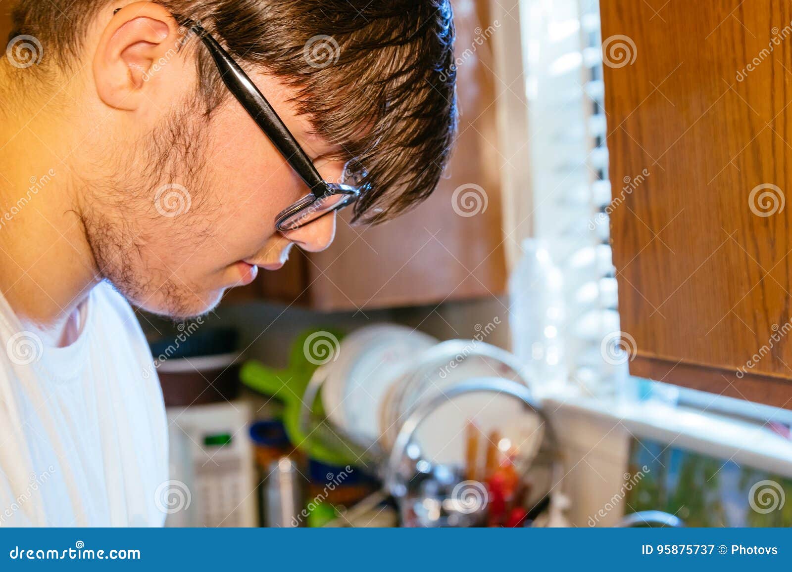 Single Household: Young Man in the Kitchen Stock Image - Image of ...