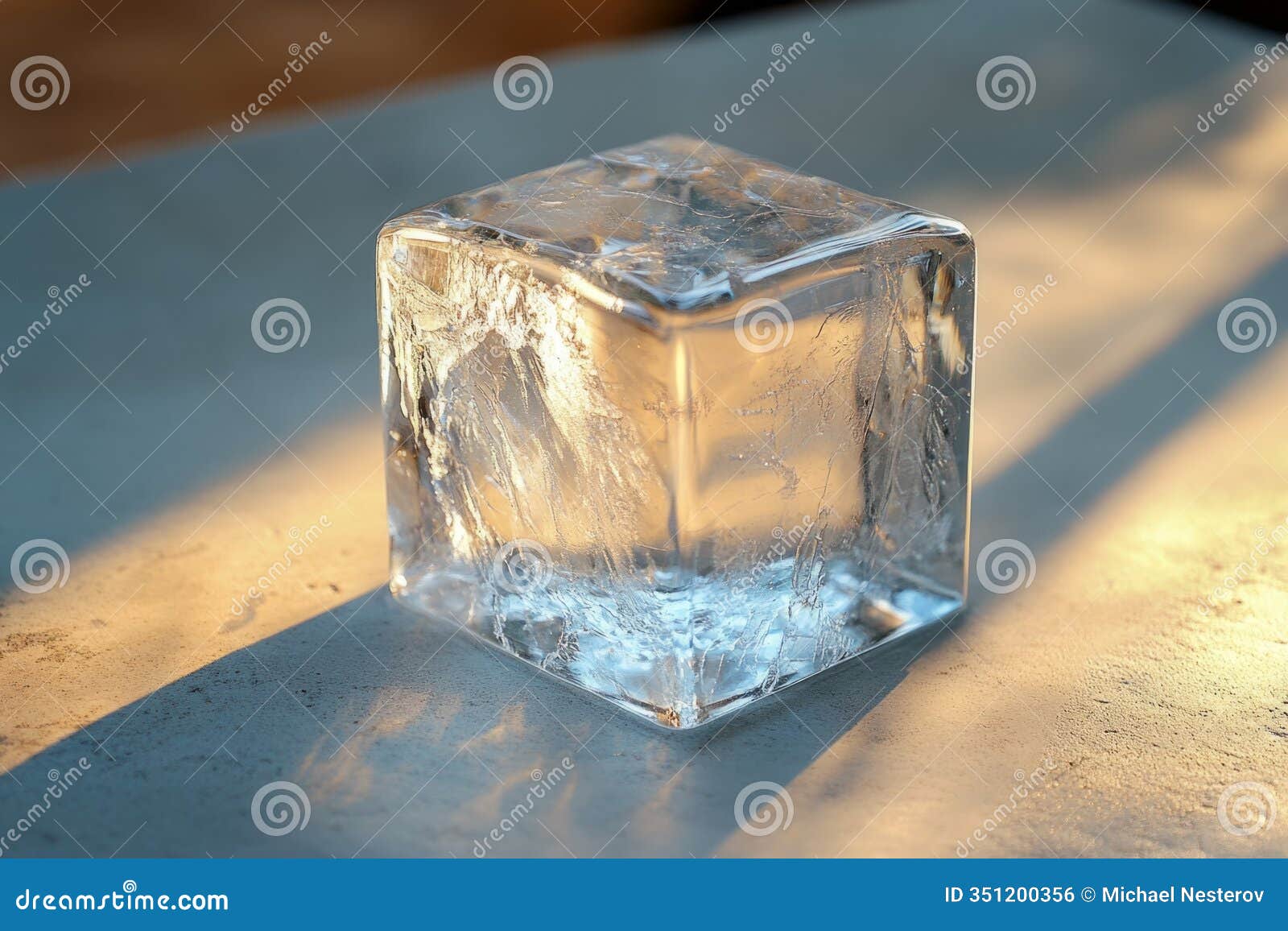 Single Ice Cube Melting on Concrete Surface Under Sunlight, Creating ...
