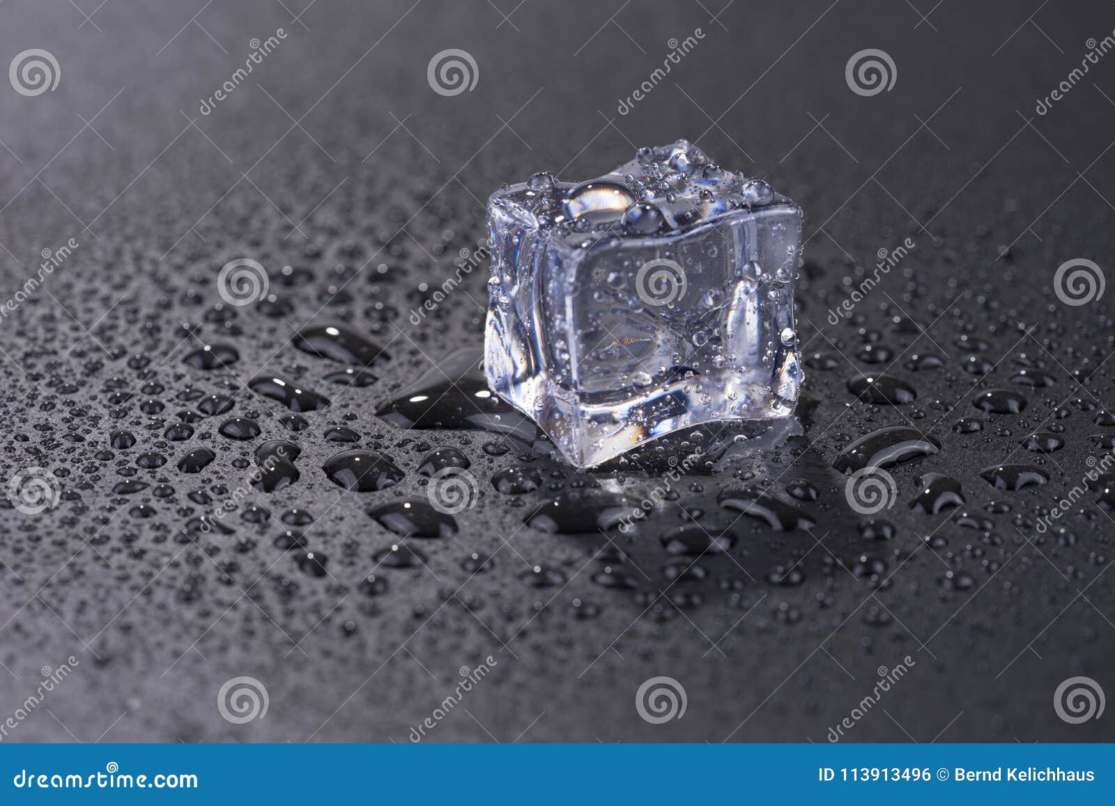 Single Ice Cube with Water Drops Isolated on Black Stock Photo - Image ...