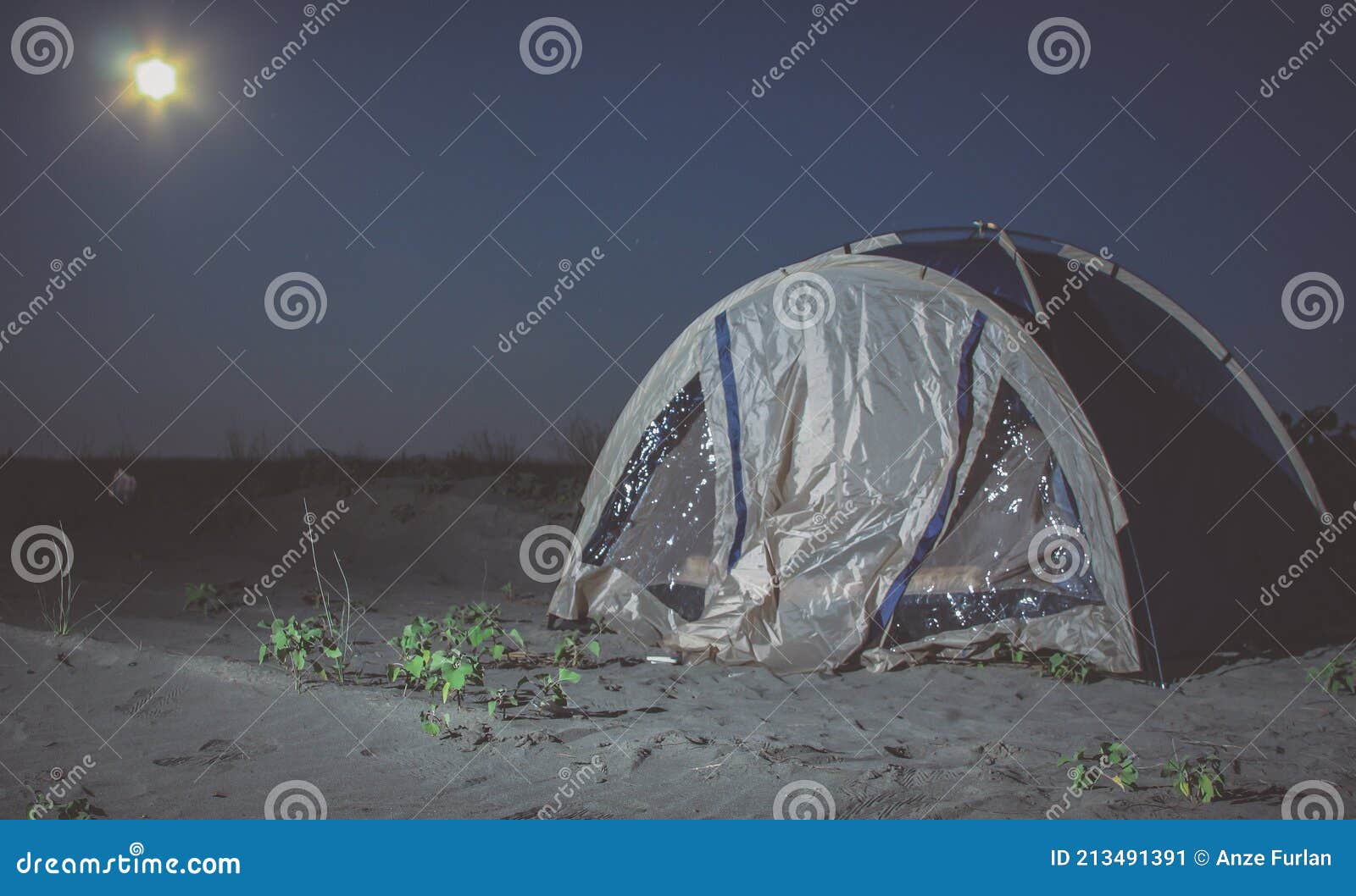 Single Igloo Tent on a Beach during Night Time. Moon is Visible Stock ...