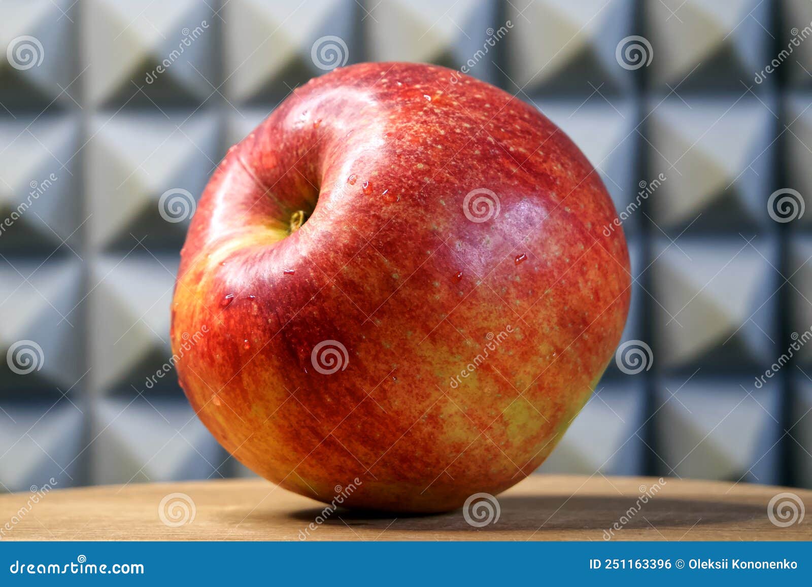 A Single Large Ripe Apple on a Wooden Surface, Side View. Apple Macro ...