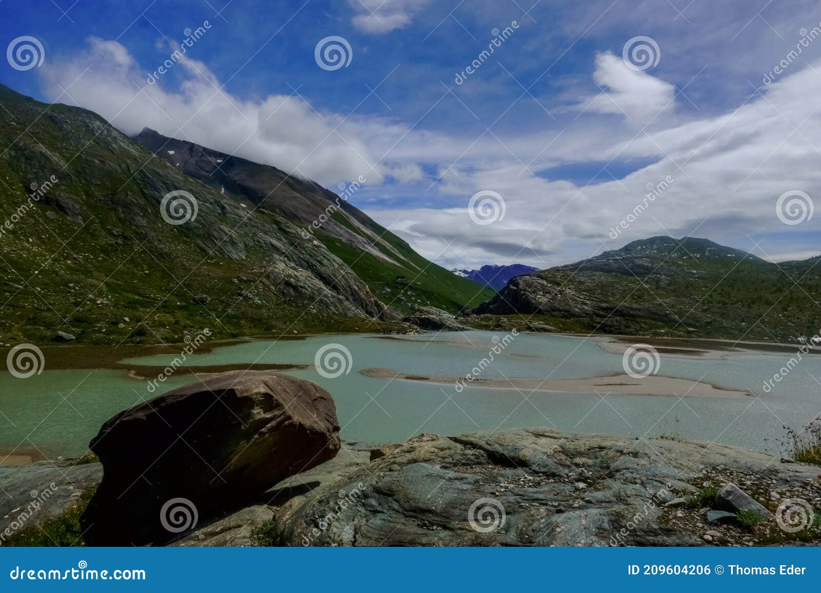 Single Large Rock at a Lake with Sandy Islands in the Mountains Stock ...