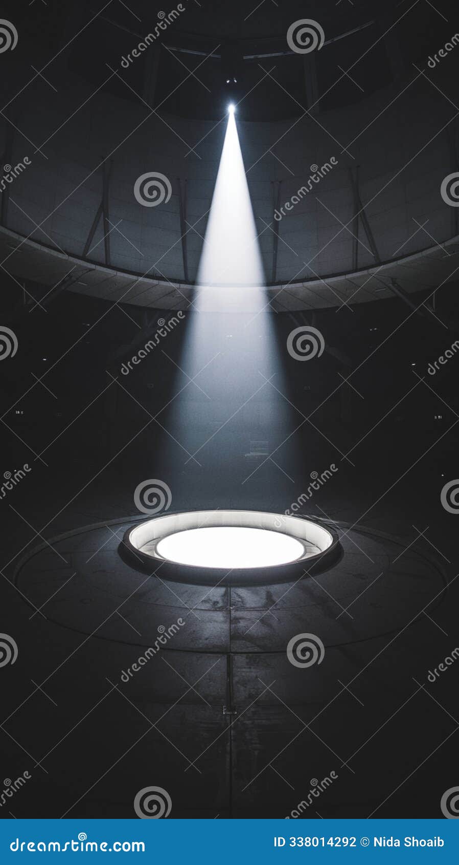 Single Light Beam Illuminates Small Circular Platform in Darkness ...