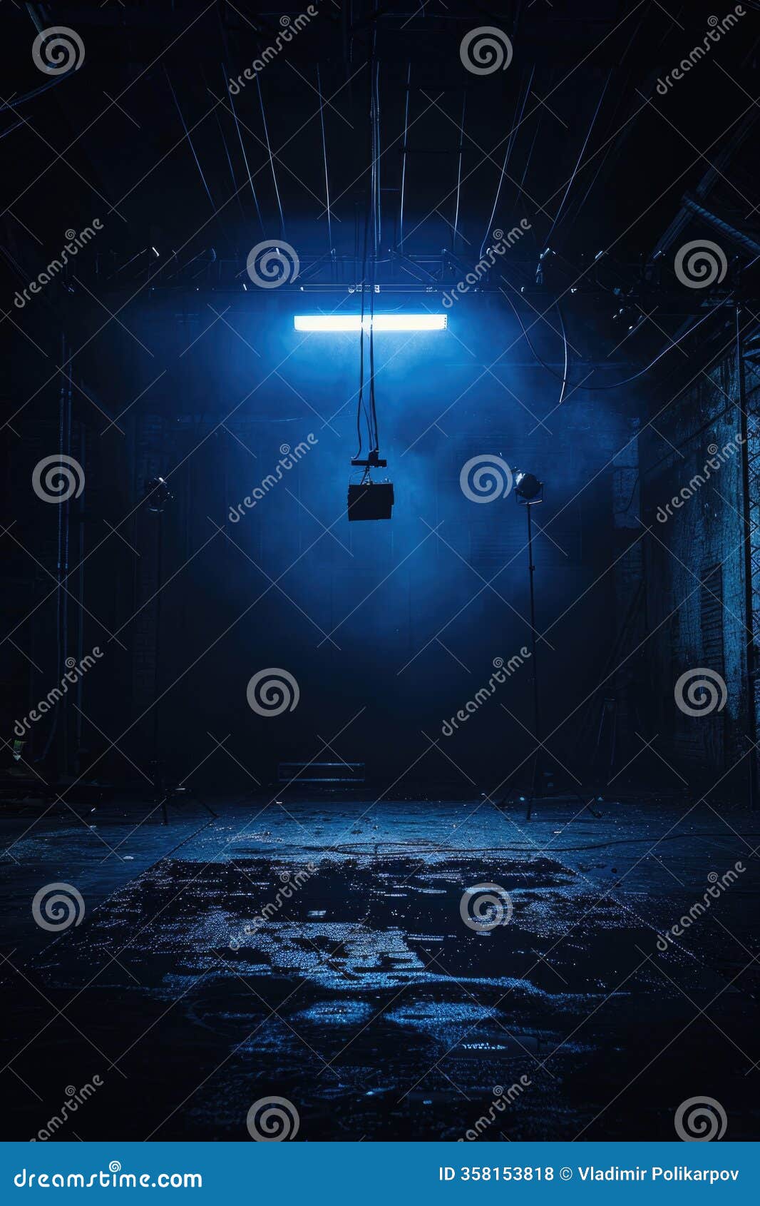 A Single Light Source Hangs from the Ceiling in a Dimly Lit Room ...