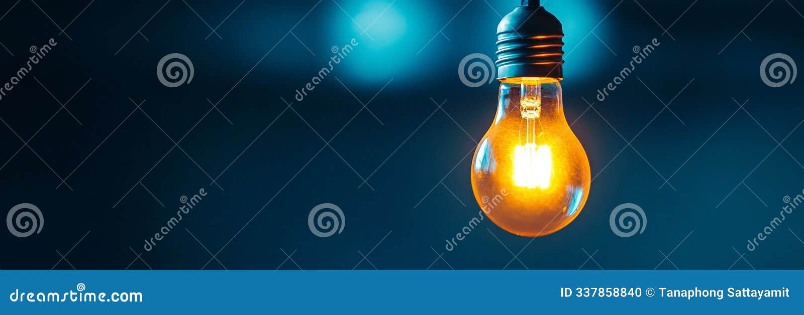 A Single Lightbulb Hangs from the Ceiling in a Dark Room Symbolizing ...