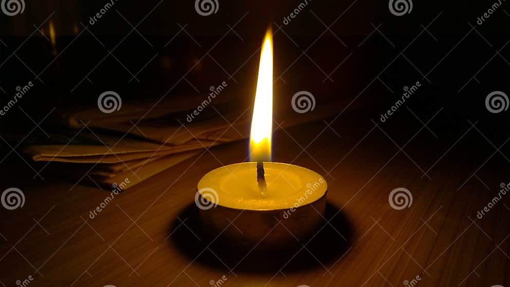 Single Lit Candle on a Table in Darkness Stock Photo - Image of soft ...