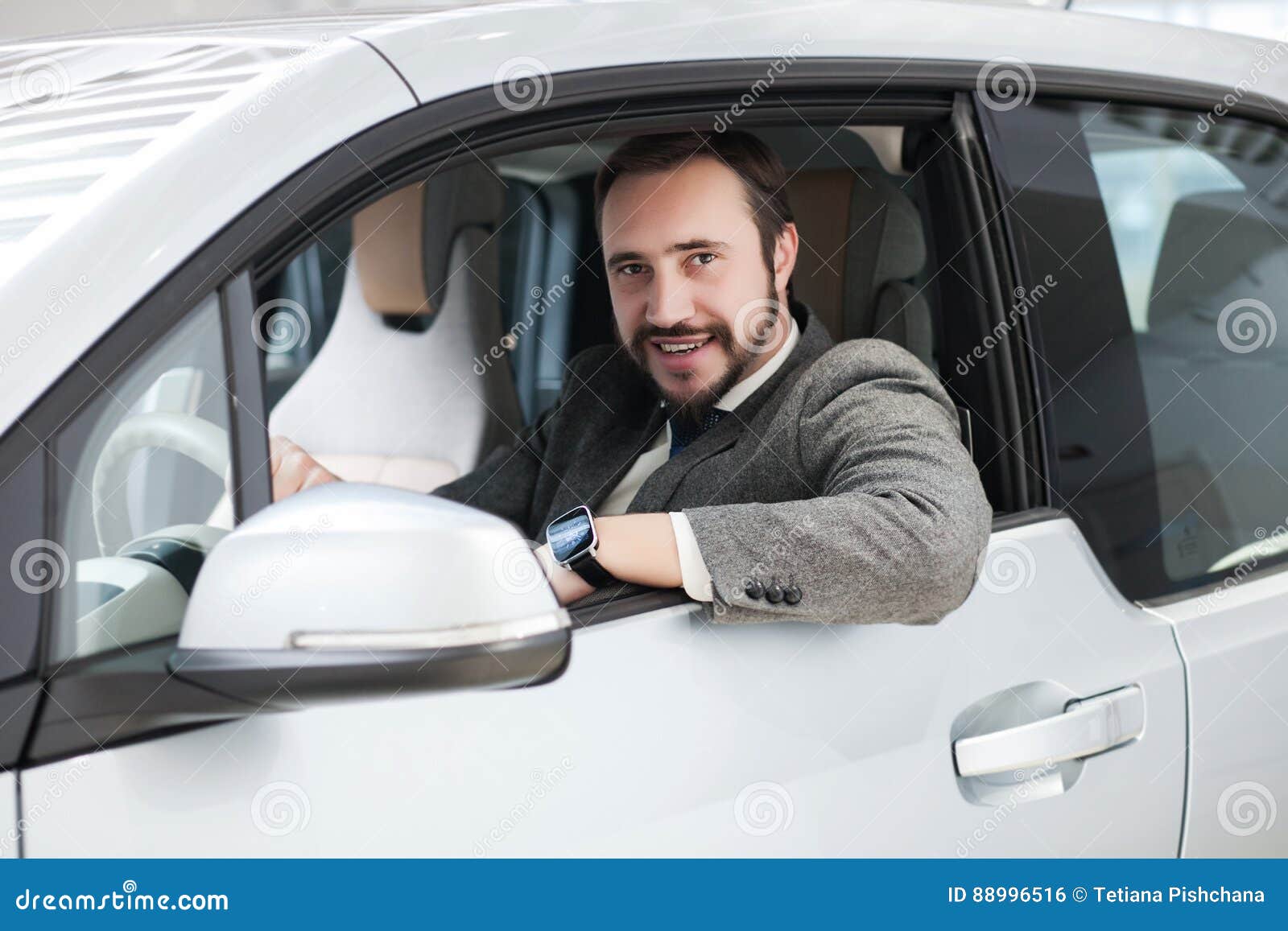 Single Man Chooses a Car in the Showroom Stock Photo - Image of male ...
