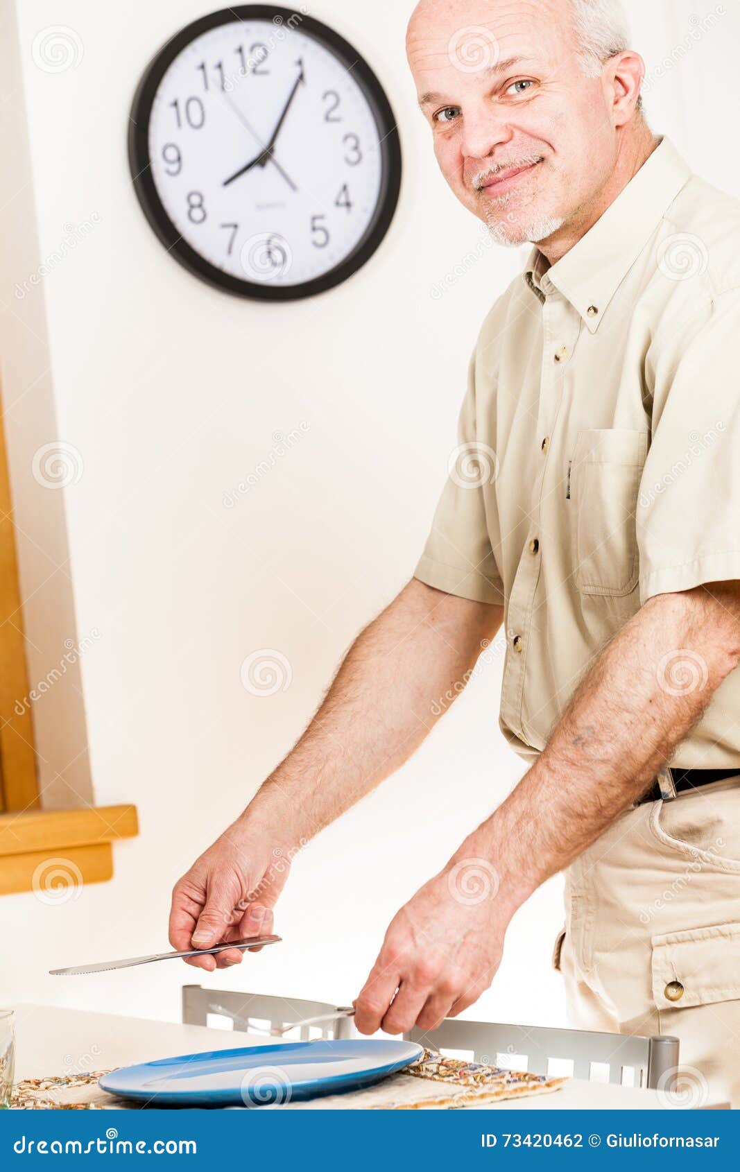 Single Man Preparing Table Setting for Meal Stock Photo - Image of aged ...