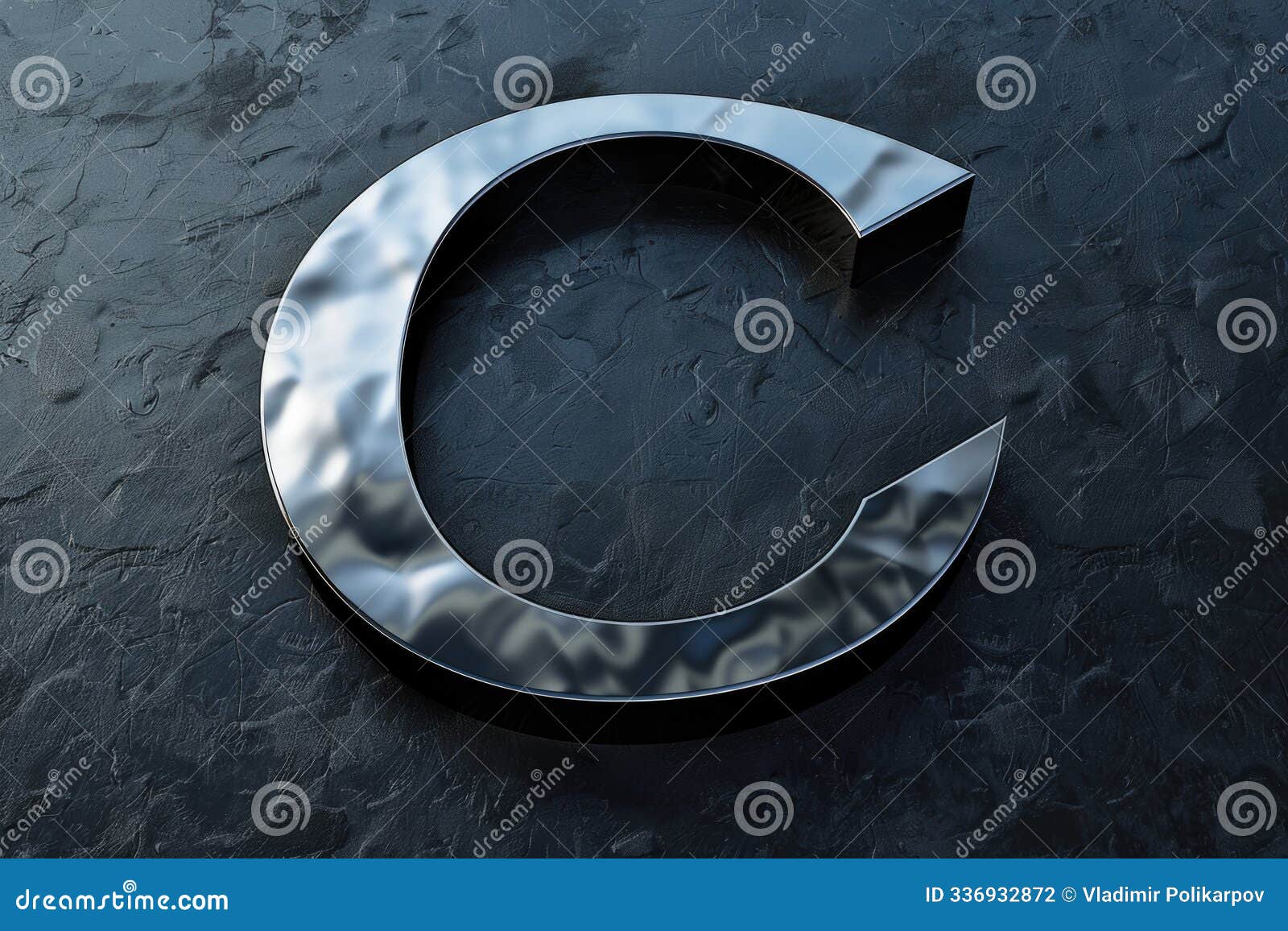 A Single Metal Letter C is Placed on a Black Surface, Providing a ...