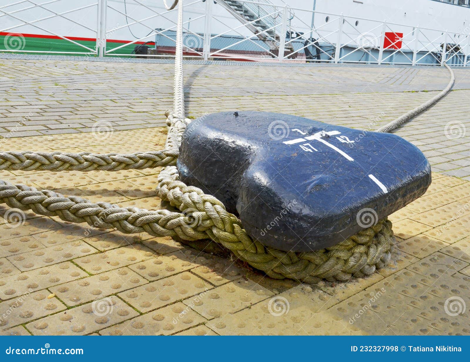 A Single Mooring Device with Coiled Ropes Keeps the Ship on the Dock ...