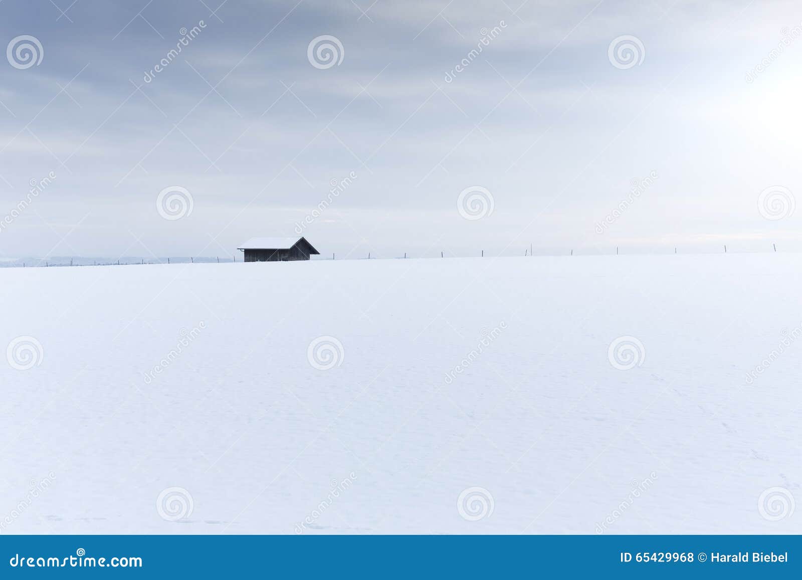 Shack In Snow Mounds With Trees And Sun Flares Stock Photography ...