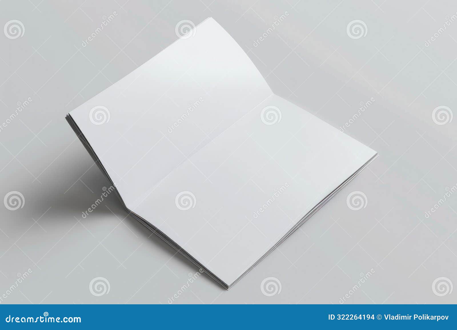 A Single Open White Book Lying Flat on a Plain, Uncluttered Surface ...