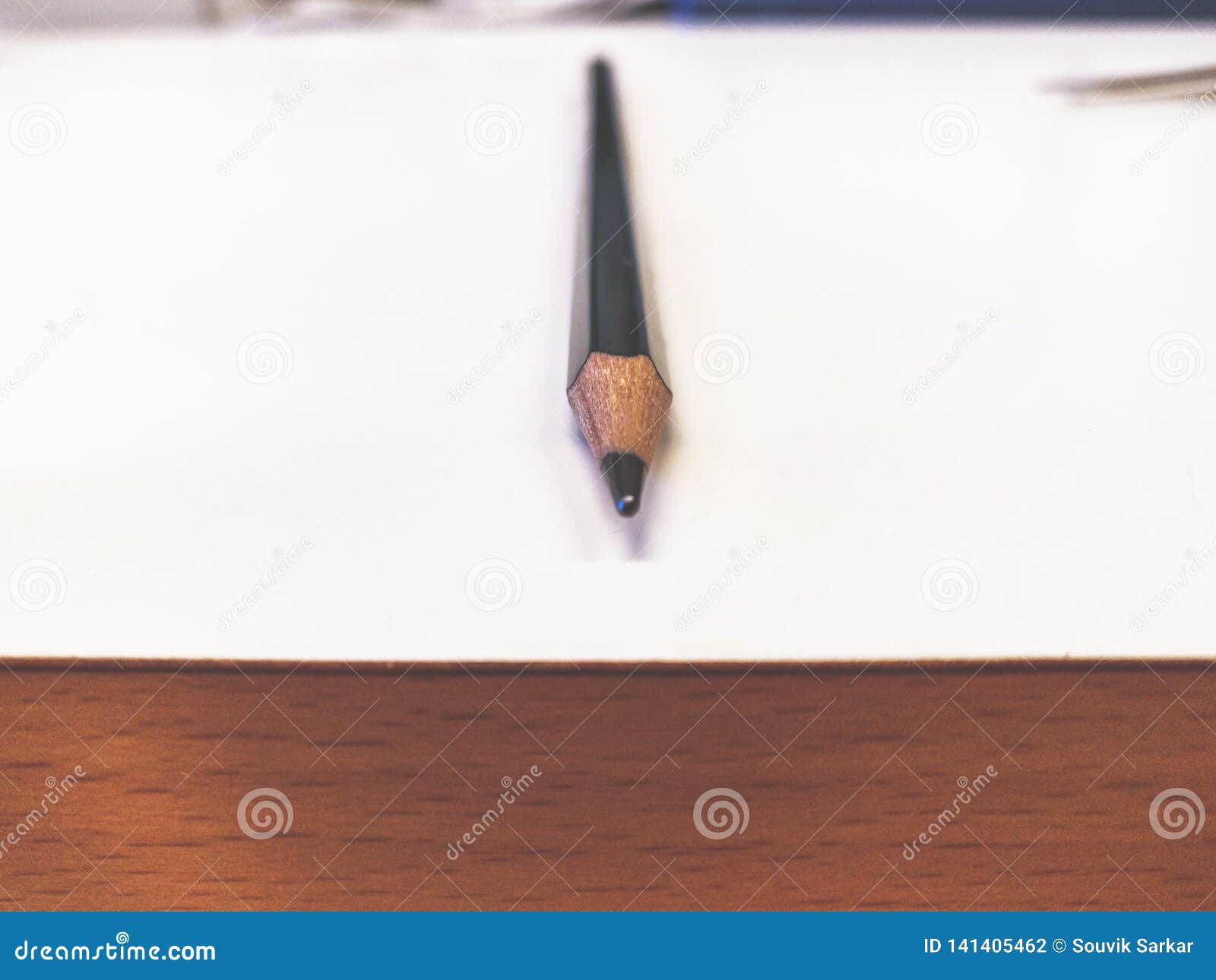 Single Pencil on a White Table with Wooden Side Panel Stock Photo ...