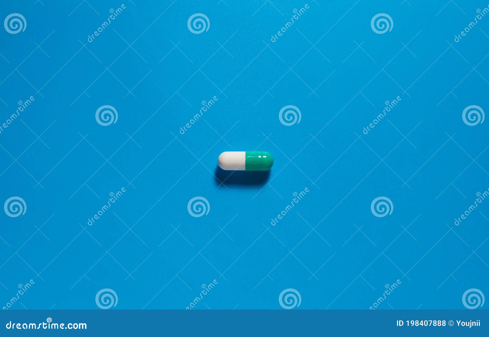 Single Pill on Blue Background Stock Photo - Image of drug, background ...