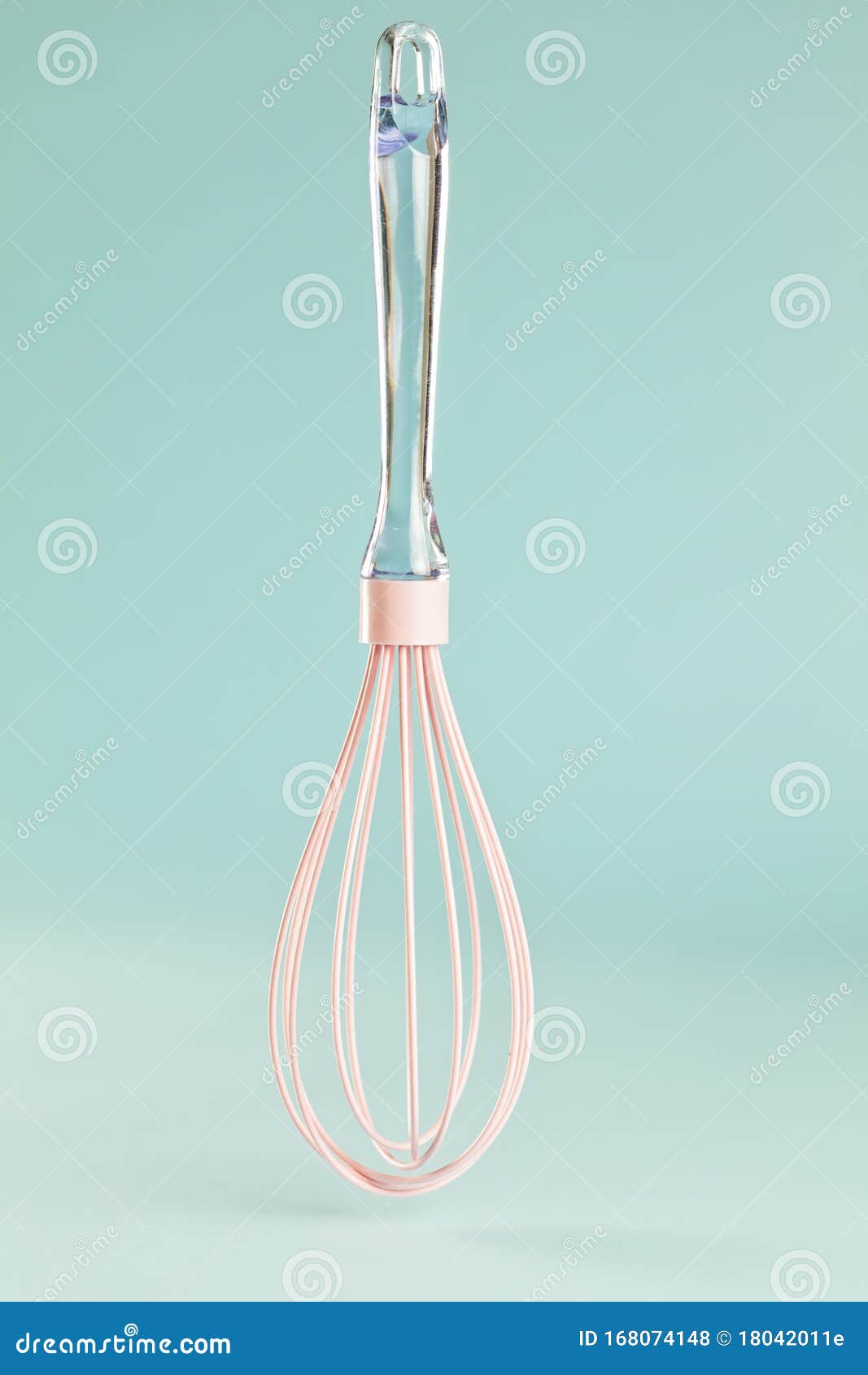 Single Pink Silicone Whisk on Light Blue Background, Vertical ...
