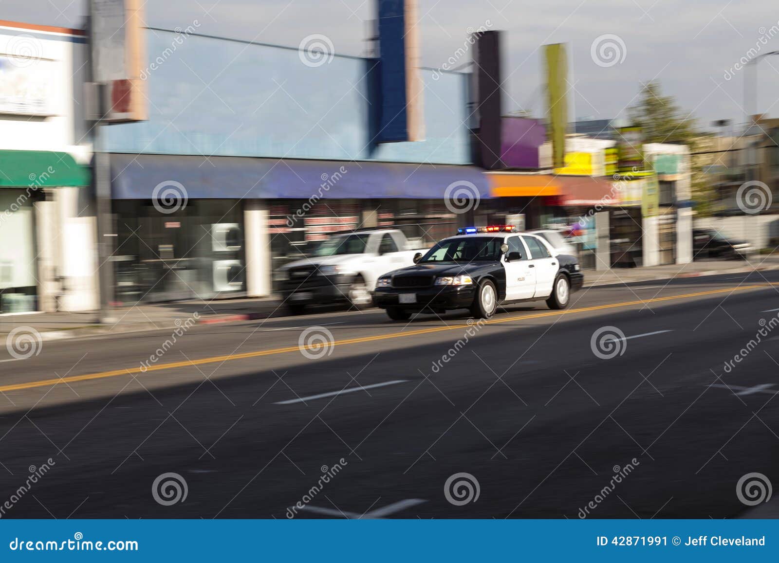 Single Police Car Lights Going Down Street Stock Image - Image of ...