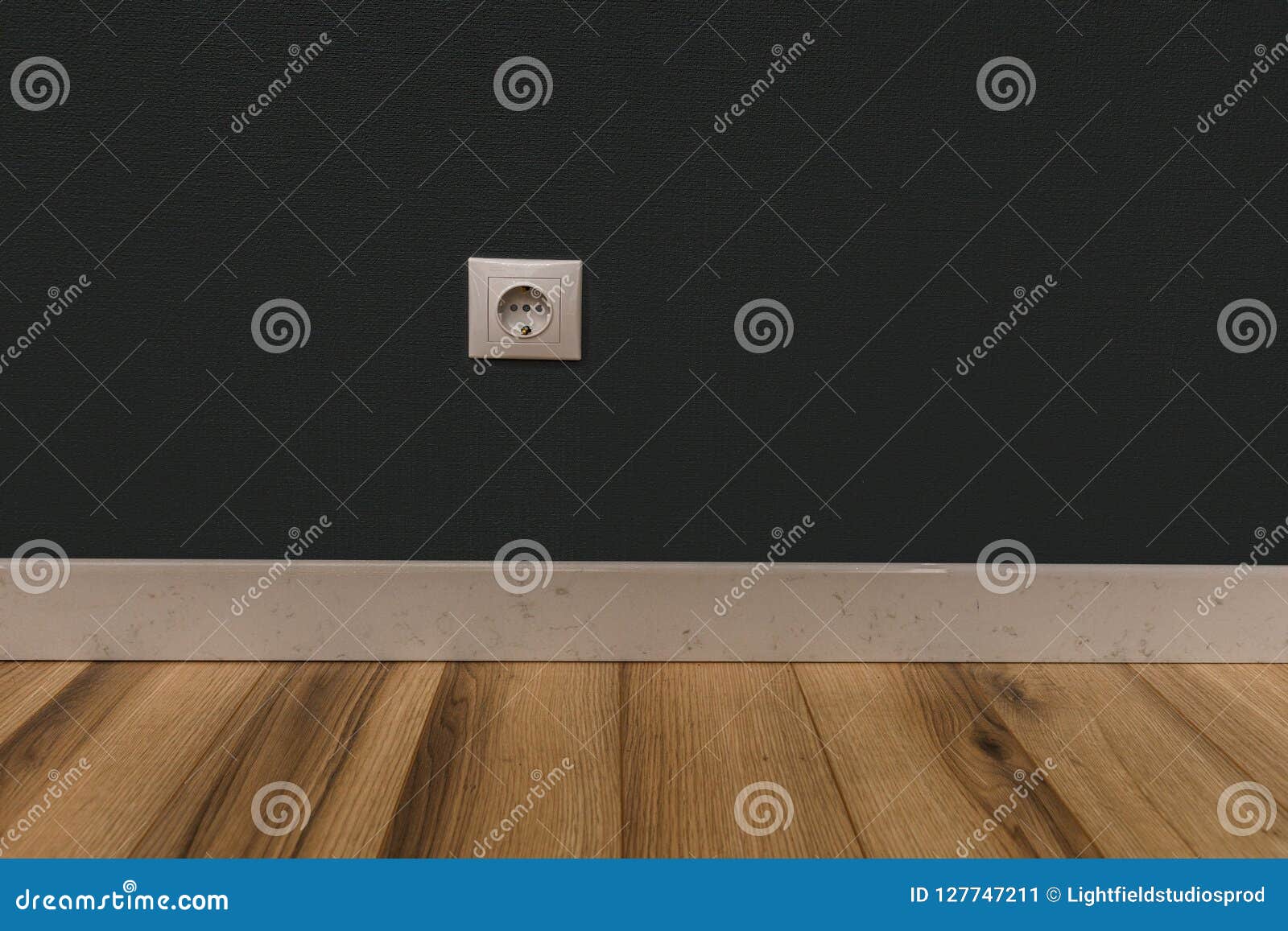Single Power Socket in Empty Wall Over Wooden Floor Stock Image - Image ...