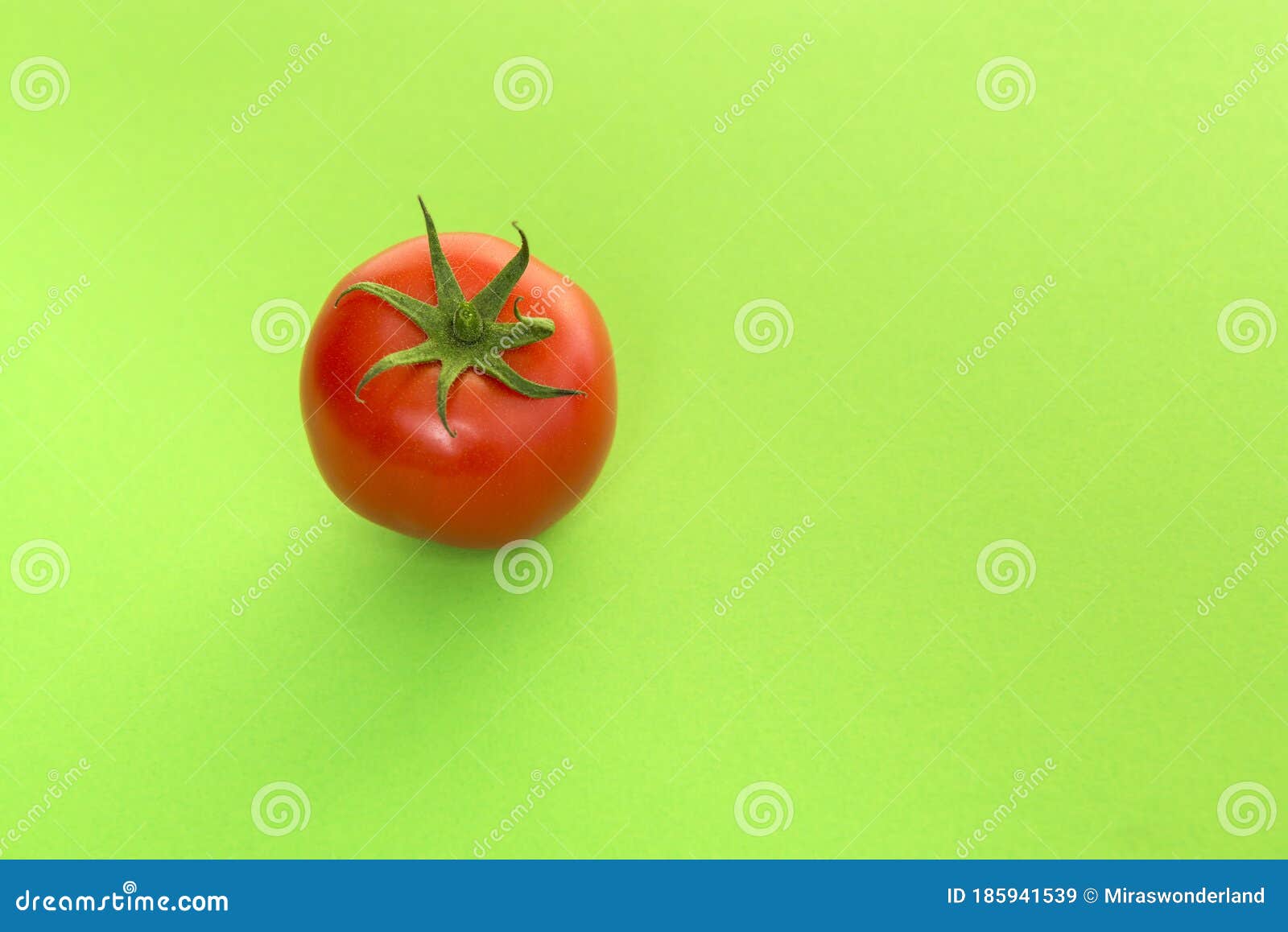 Single Real Tomato Seen at Its Top on a Green Background Stock Image ...