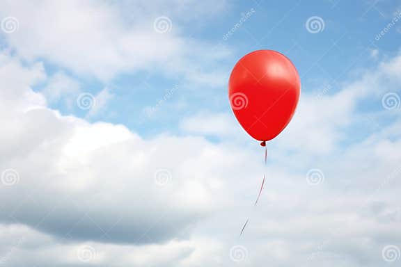 A Single Red Balloon Released into a Cloudy Sky Stock Photo - Image of ...