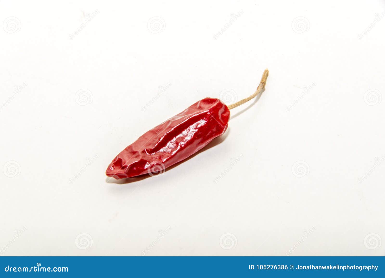 A Single Red Chilli on a White Background Stock Photo - Image of cook ...